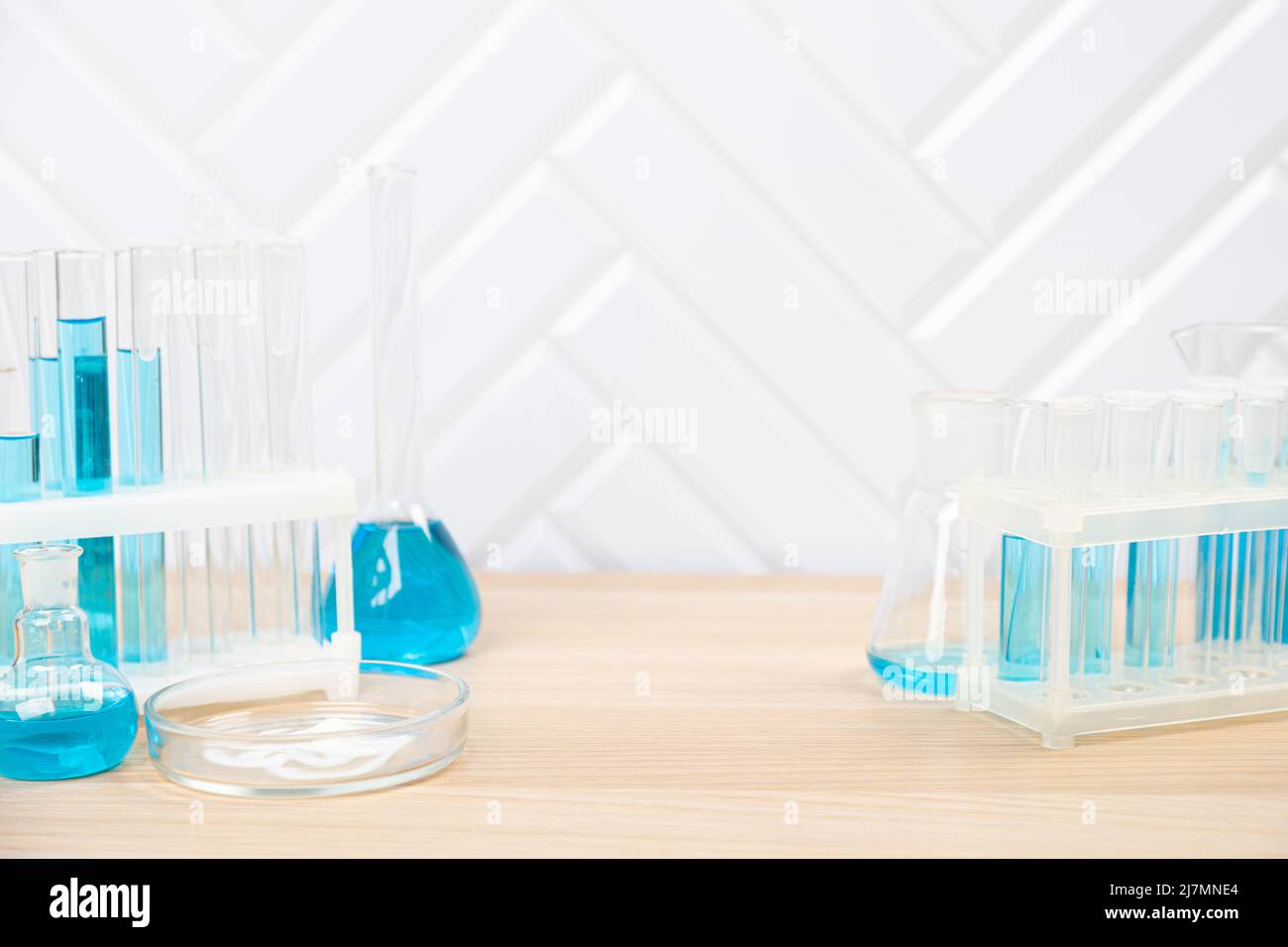 Laboratory glassware with test tubes. flasks, dropper, petri dishes ...