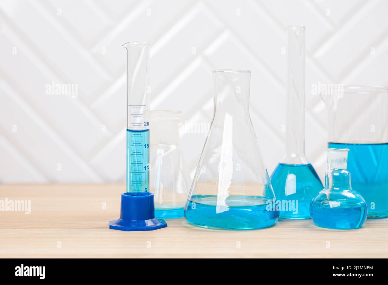 Laboratory glassware with test tubes. flasks, dropper, petri dishes ...