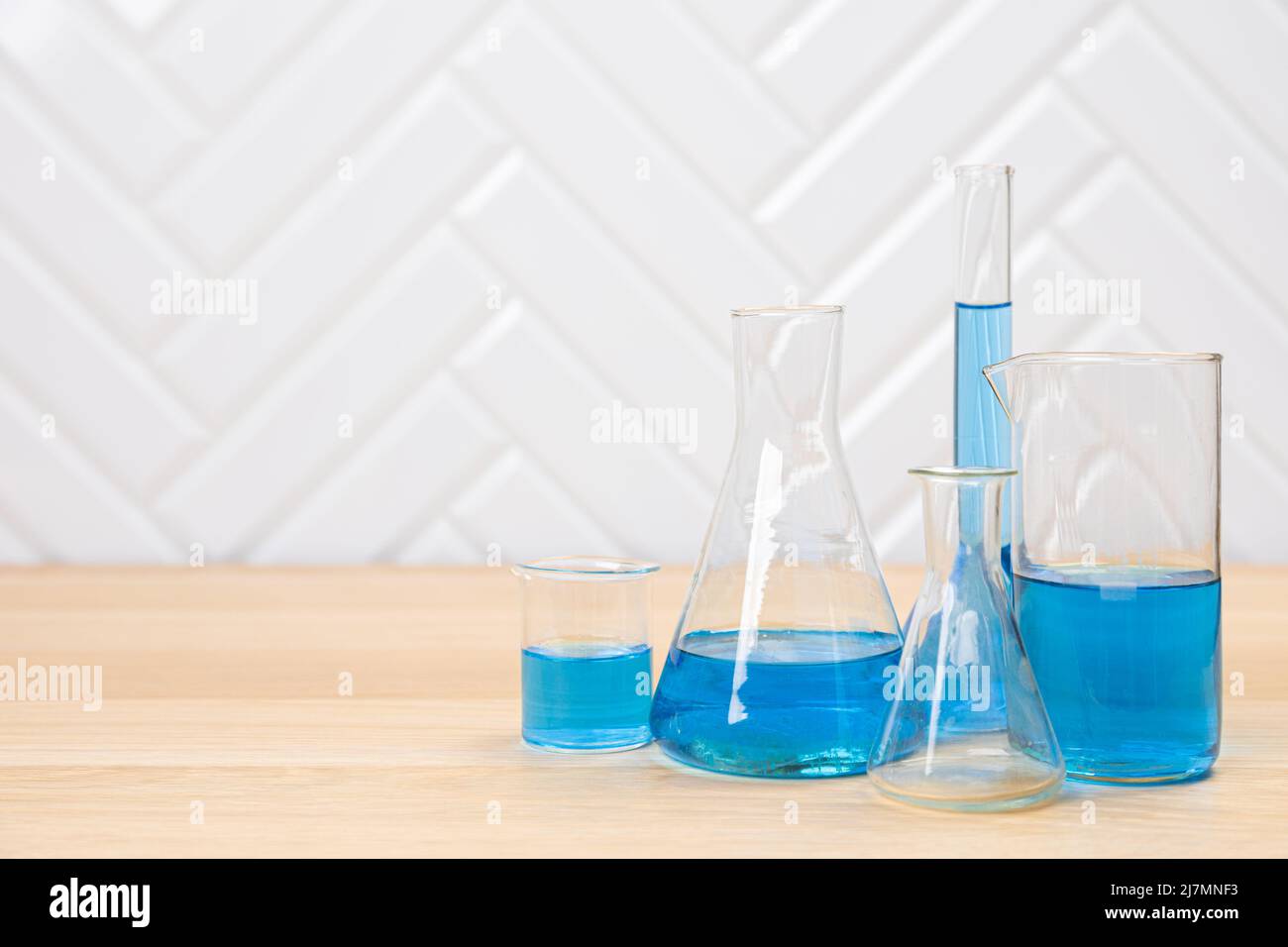Laboratory glassware with test tubes. flasks, dropper, petri dishes ...