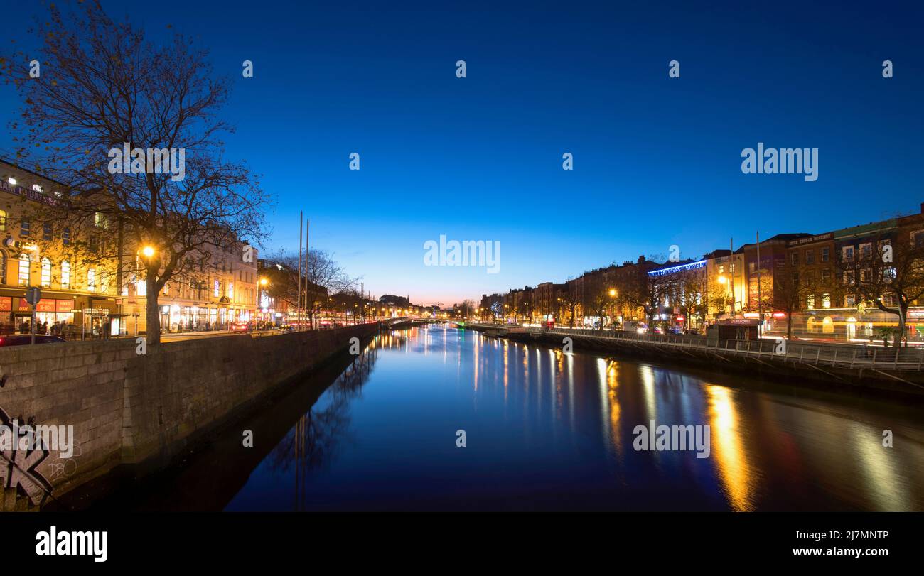 Buildings align a city's riverside quays, River Liffy at Temple bar ...