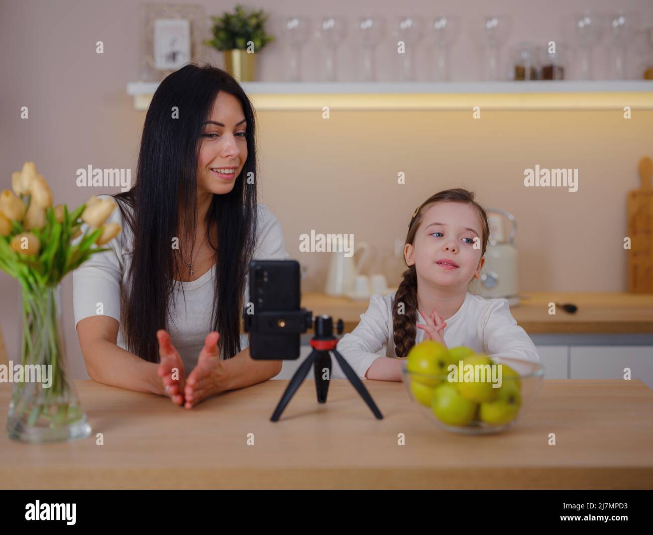 Blogger mom with her baby at home. Millennial Influencer woman creating ...