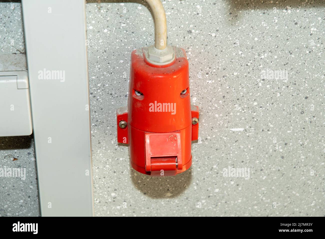 Power socket on the garage wall Stock Photo - Alamy