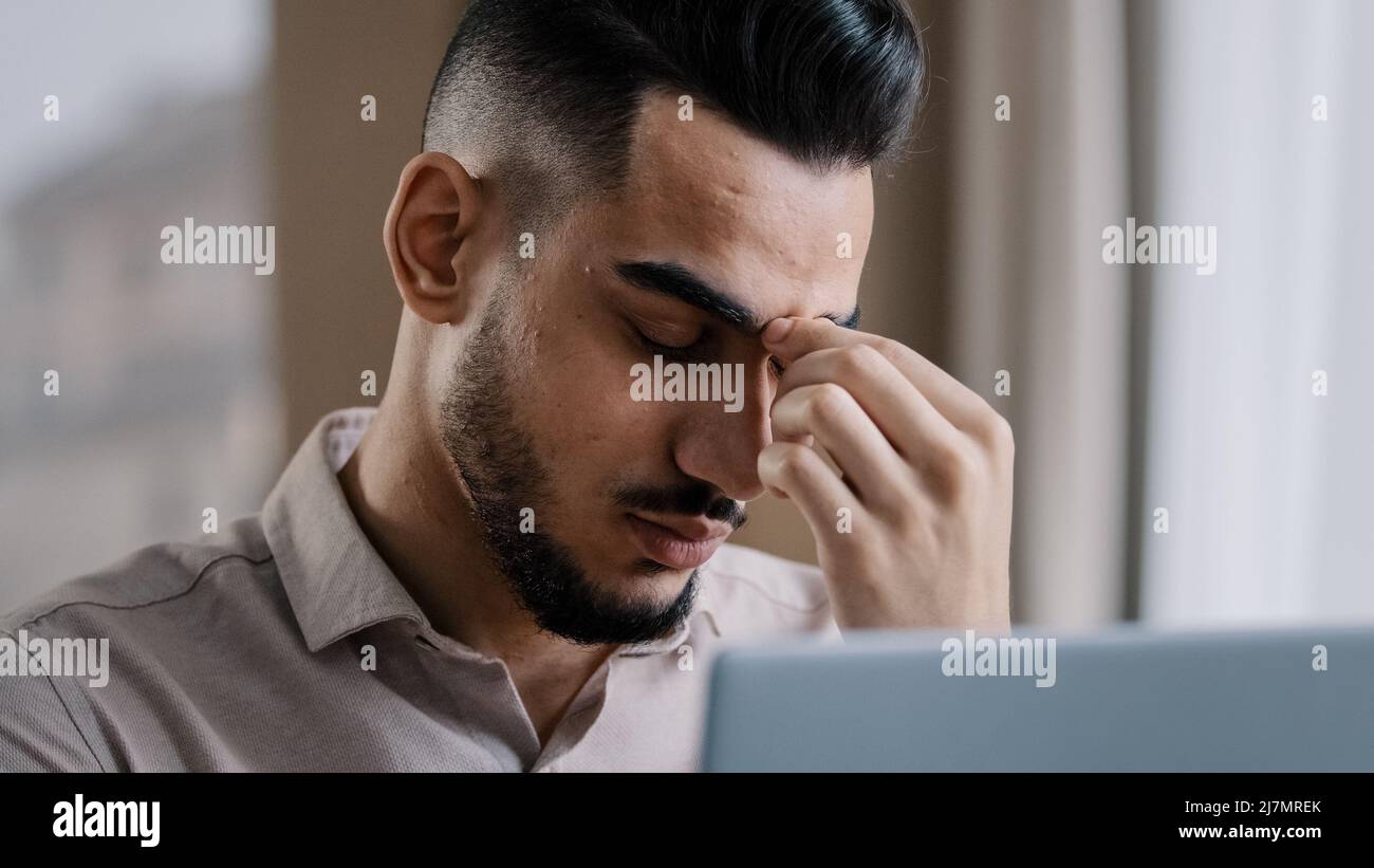 Exhausted young millennial businessman overworked male worker employee ...