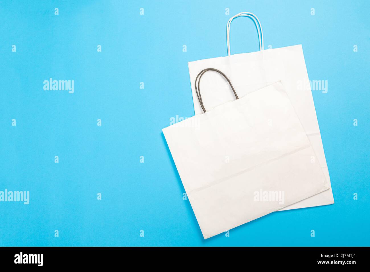 eco blank white paper carry bag with shopping handles facing forward on ...