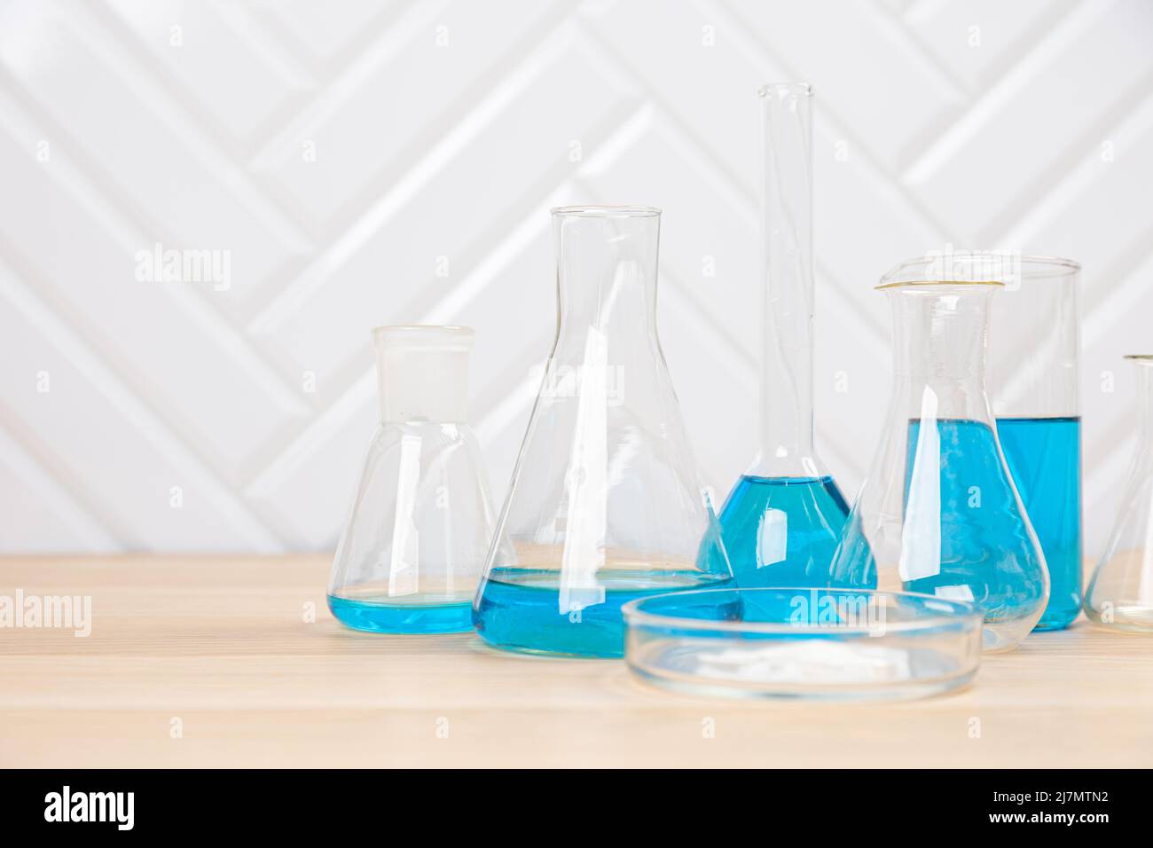 Laboratory glassware with test tubes. flasks, dropper, petri dishes ...