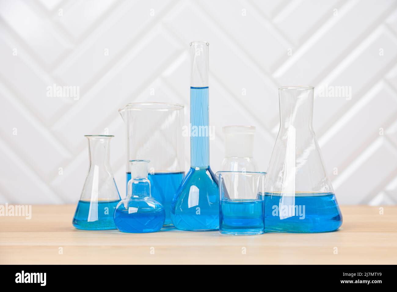 Laboratory glassware with test tubes. flasks, dropper, petri dishes ...