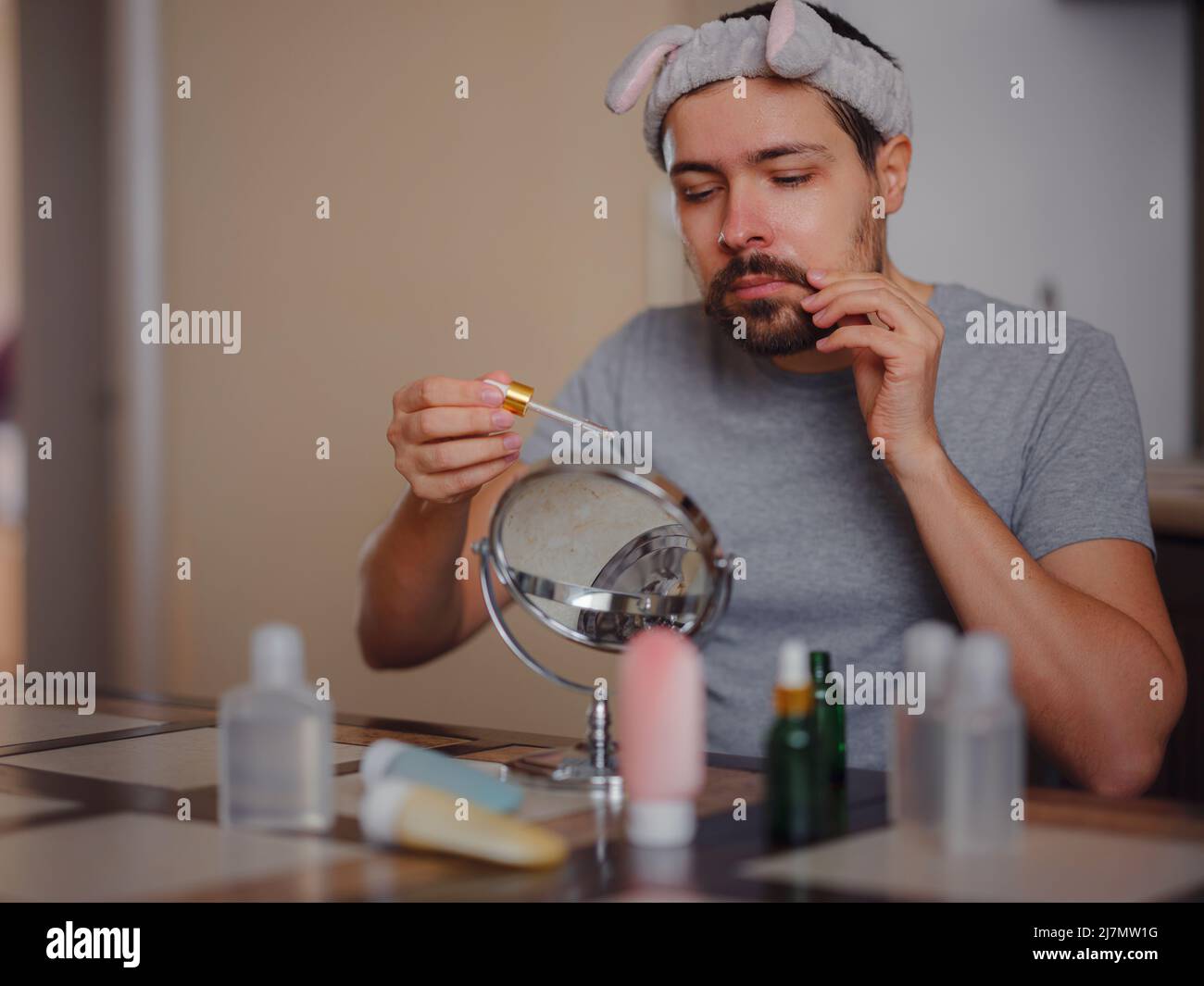 Men's beauty concept. caucAsian guy checking his skin. Skin nutrition ...