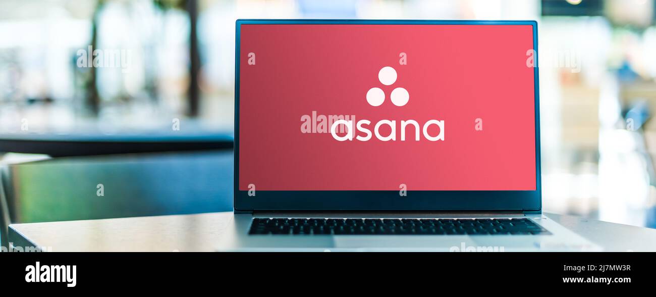 POZNAN, POL - DEC 8, 2021: Laptop computer displaying logo of Asana, a ...