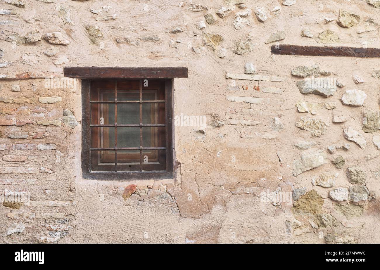 detail of a window with grille in a stone wall of a Castilian house ...