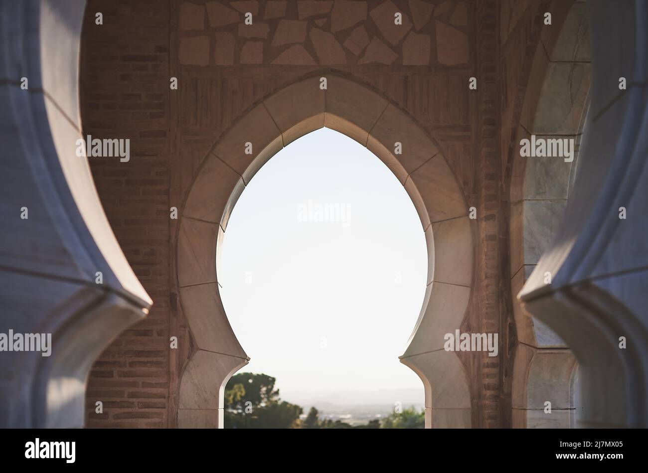 detail of a view of a landscape at sunset through a set of Muslim ...