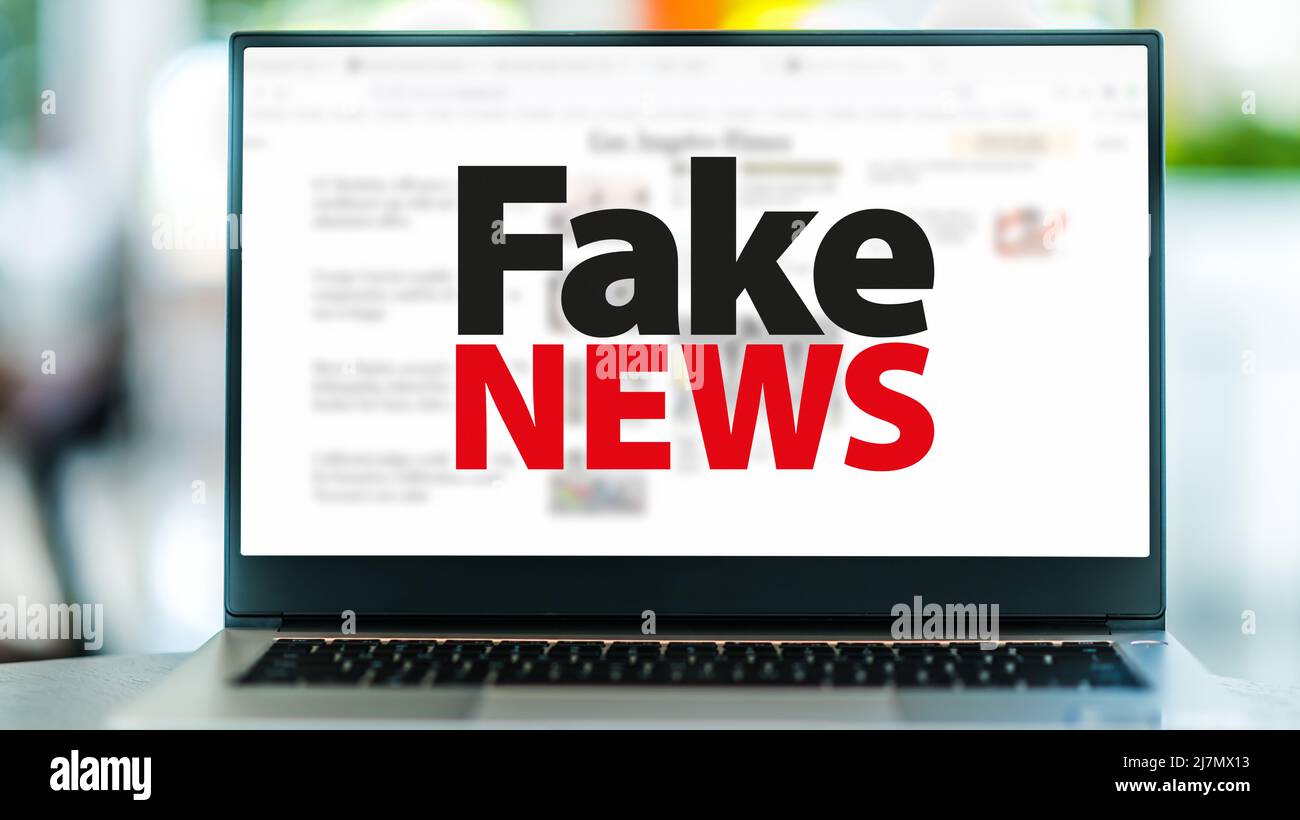 Laptop computer displaying the sign of 'Fake news' Stock Photo - Alamy