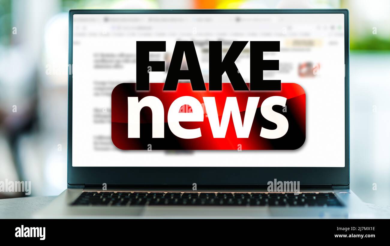 Laptop computer displaying the sign of 'Fake news' Stock Photo - Alamy