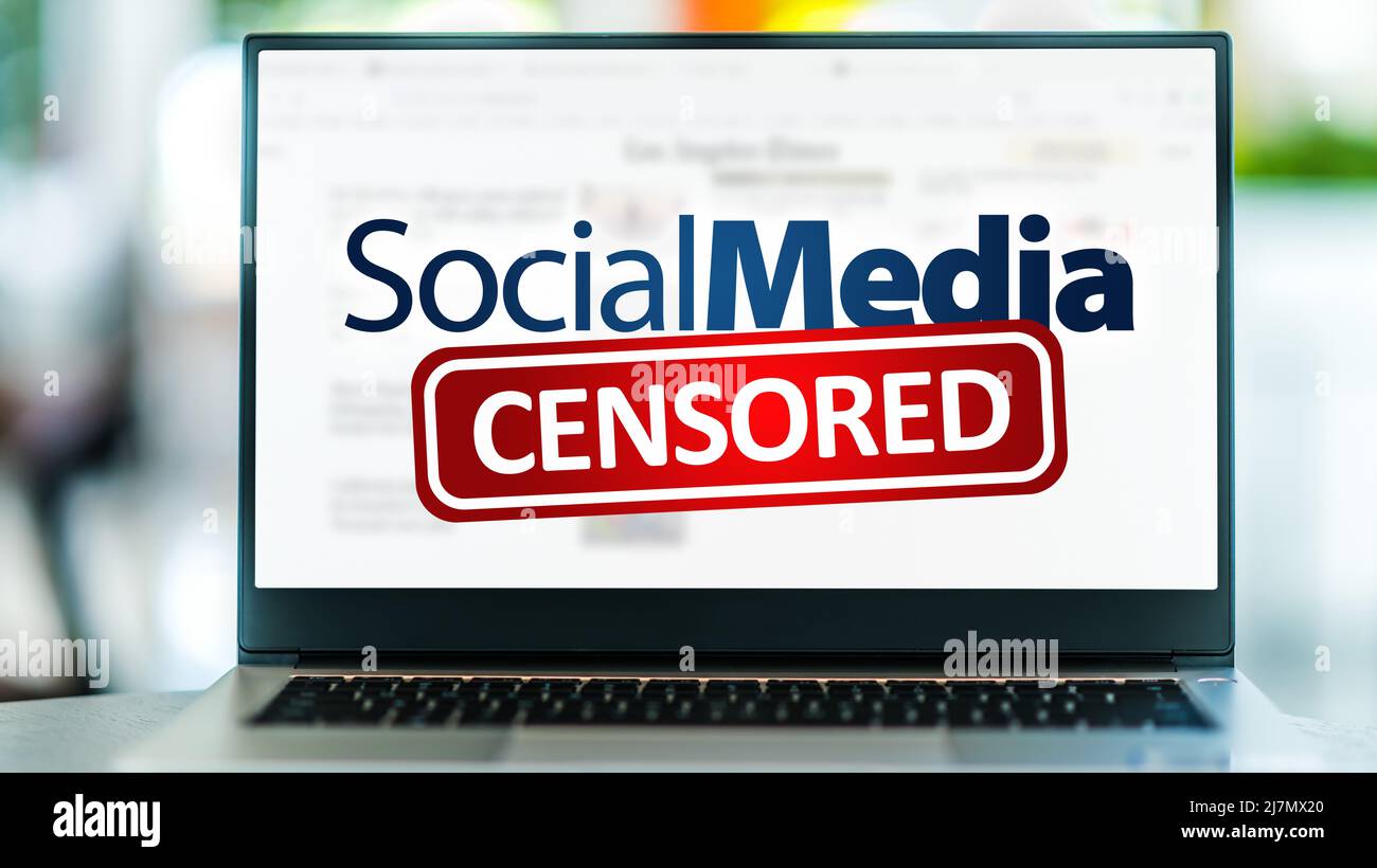Laptop computer with the sign warning against censorship in social ...
