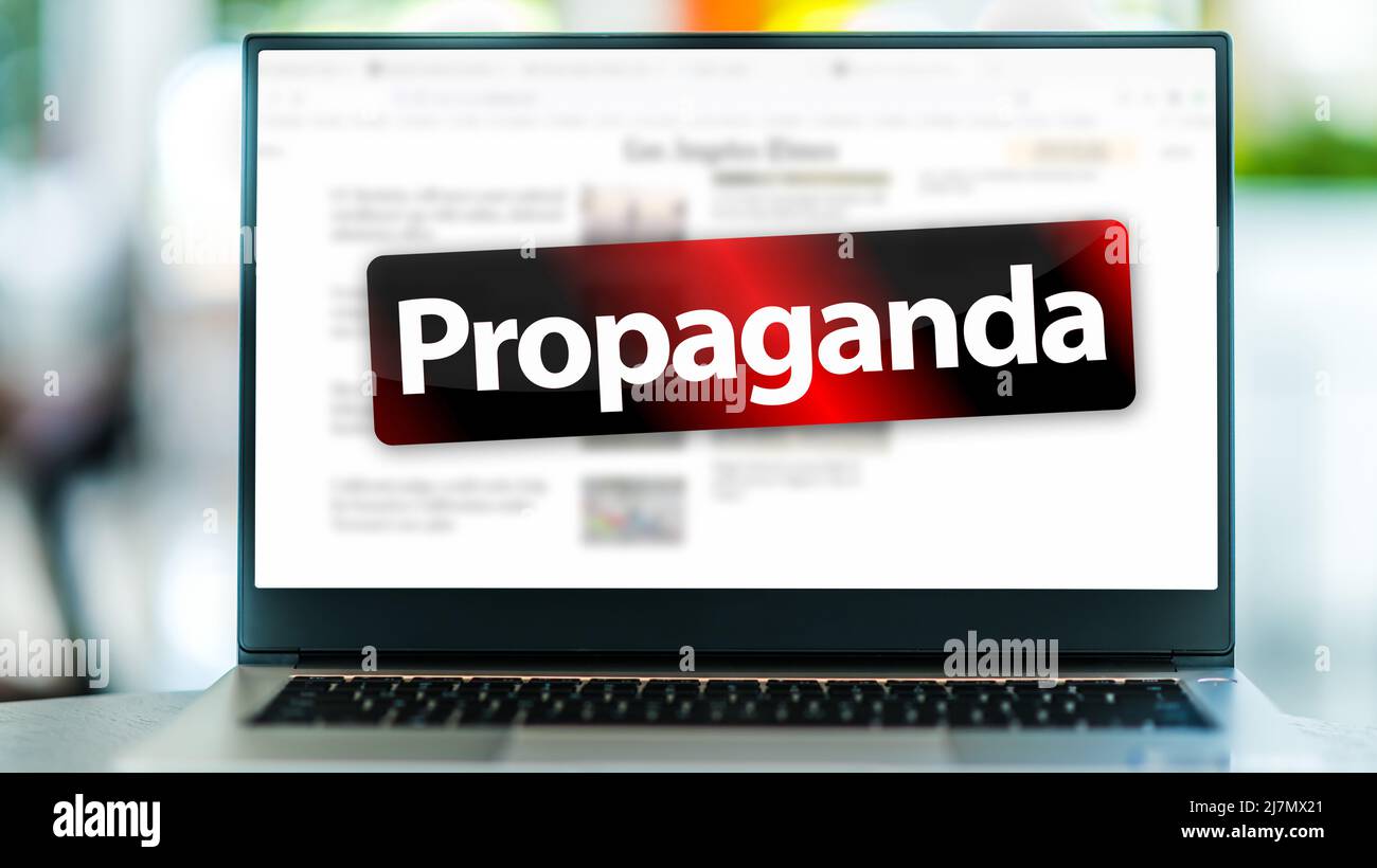 Laptop computer displaying the sign of 'Propagada' Stock Photo - Alamy