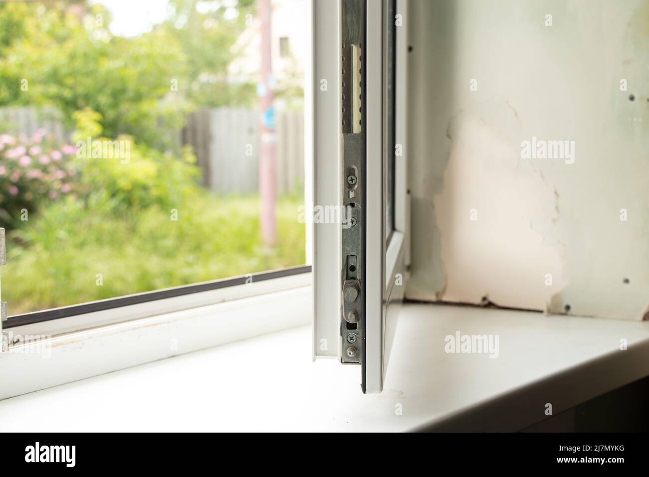 dirty window with a sill with mold from dampness, fungus on the window ...