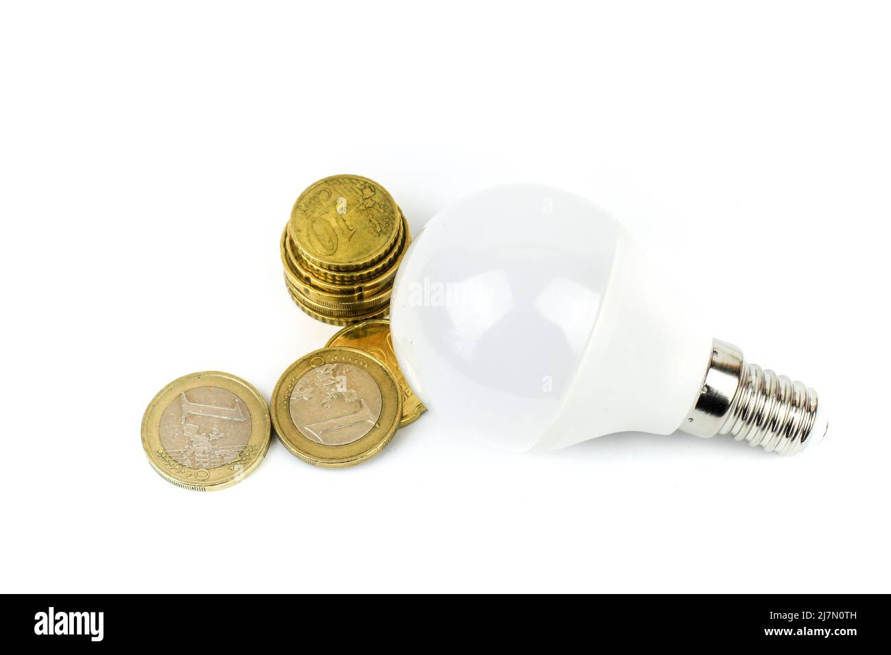 Led light bulb next to euro coins on white background Stock Photo - Alamy