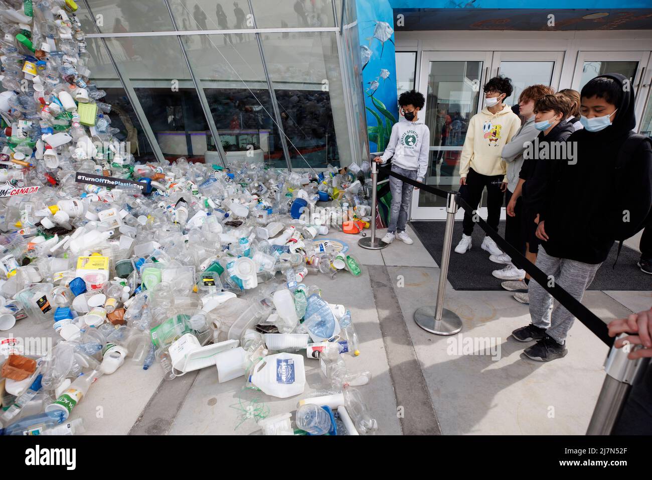 KidÕs look on at Benjamin Von WongÕs plastic tower art exhibit outside ...