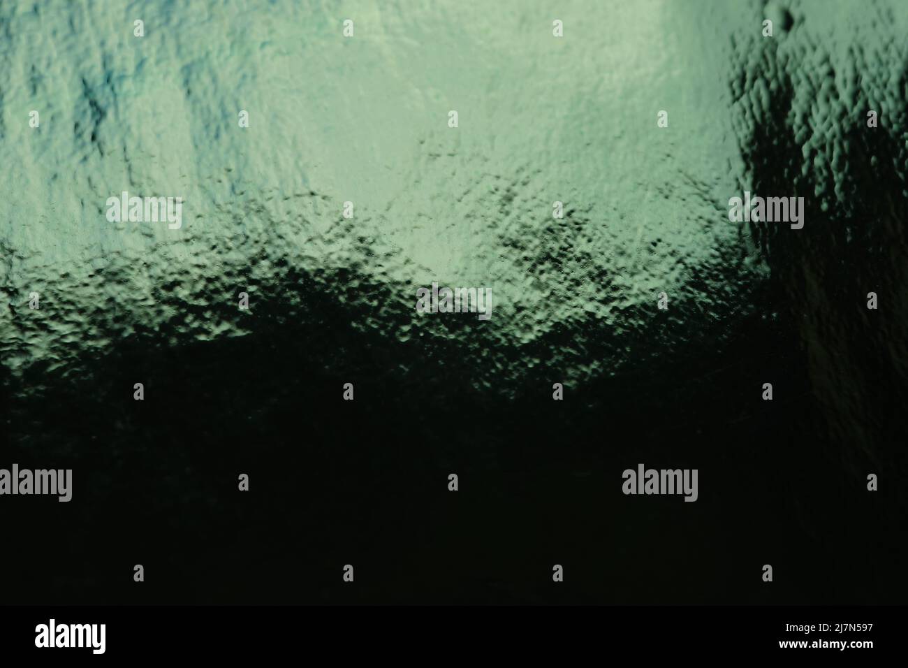 Saturated shiny green background with light reflection. Anahata chakra ...