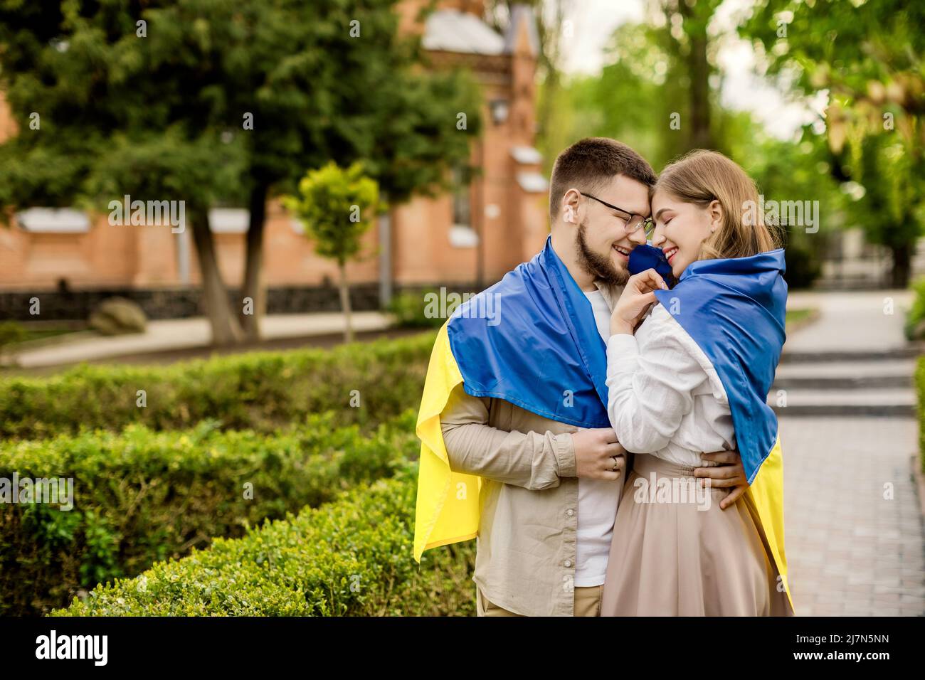 Love Ukraine concept. Lovely young couple hugging with flag ...