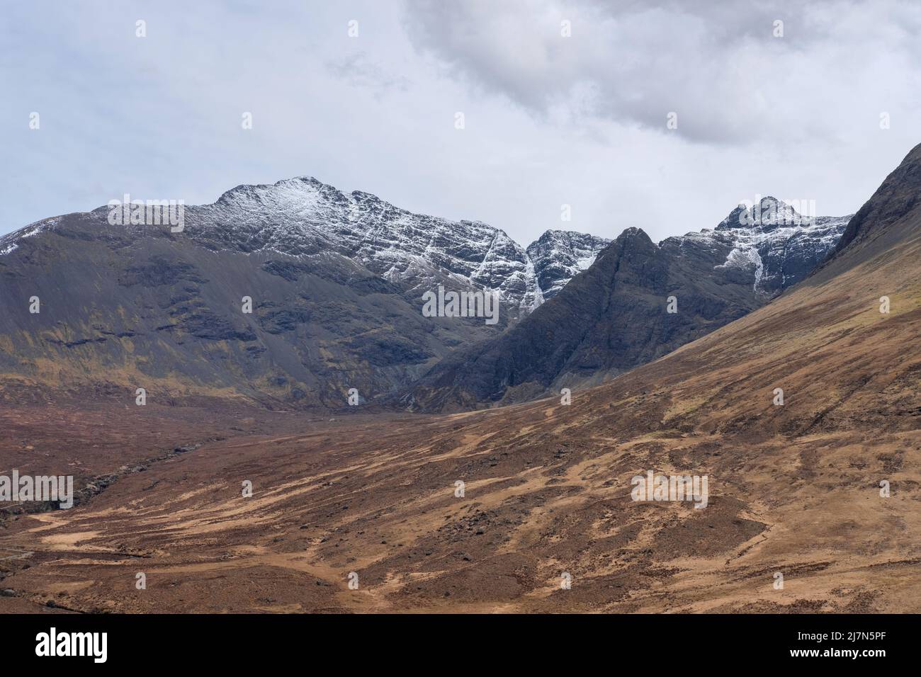 Frozen landscape surrounding Black Cuillin mountains, cold alien-like ...