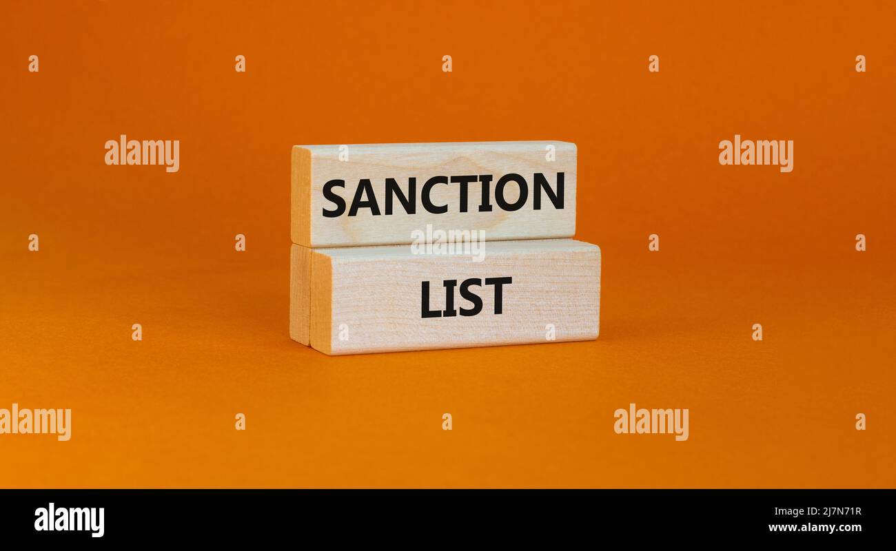 Sanction list symbol. Wooden blocks with concept words Sanction list on ...