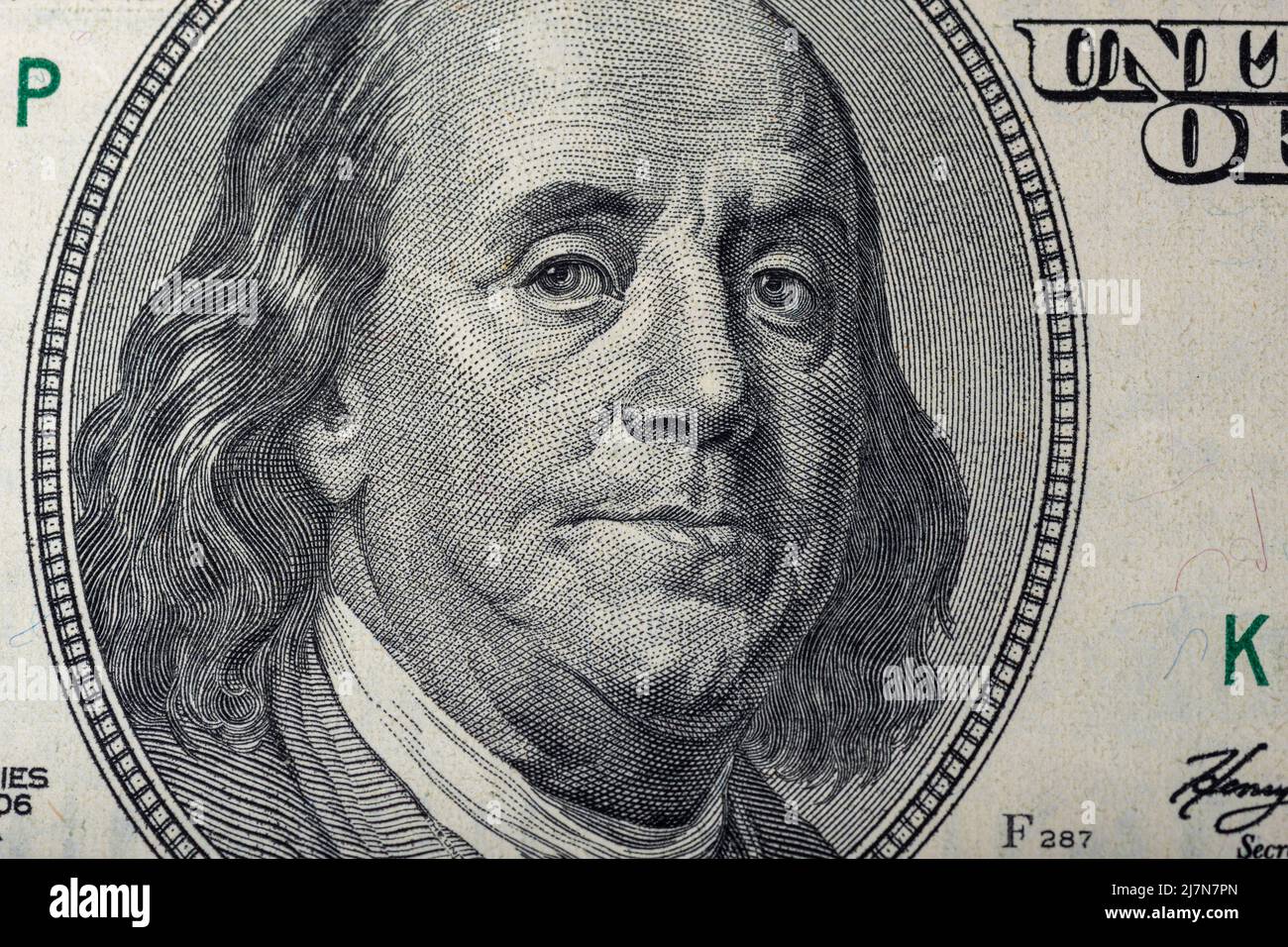 Portrait of Ben Franklin on the US 100 dollar bill in macro. Benjamin Franklin on hundred dollar ...