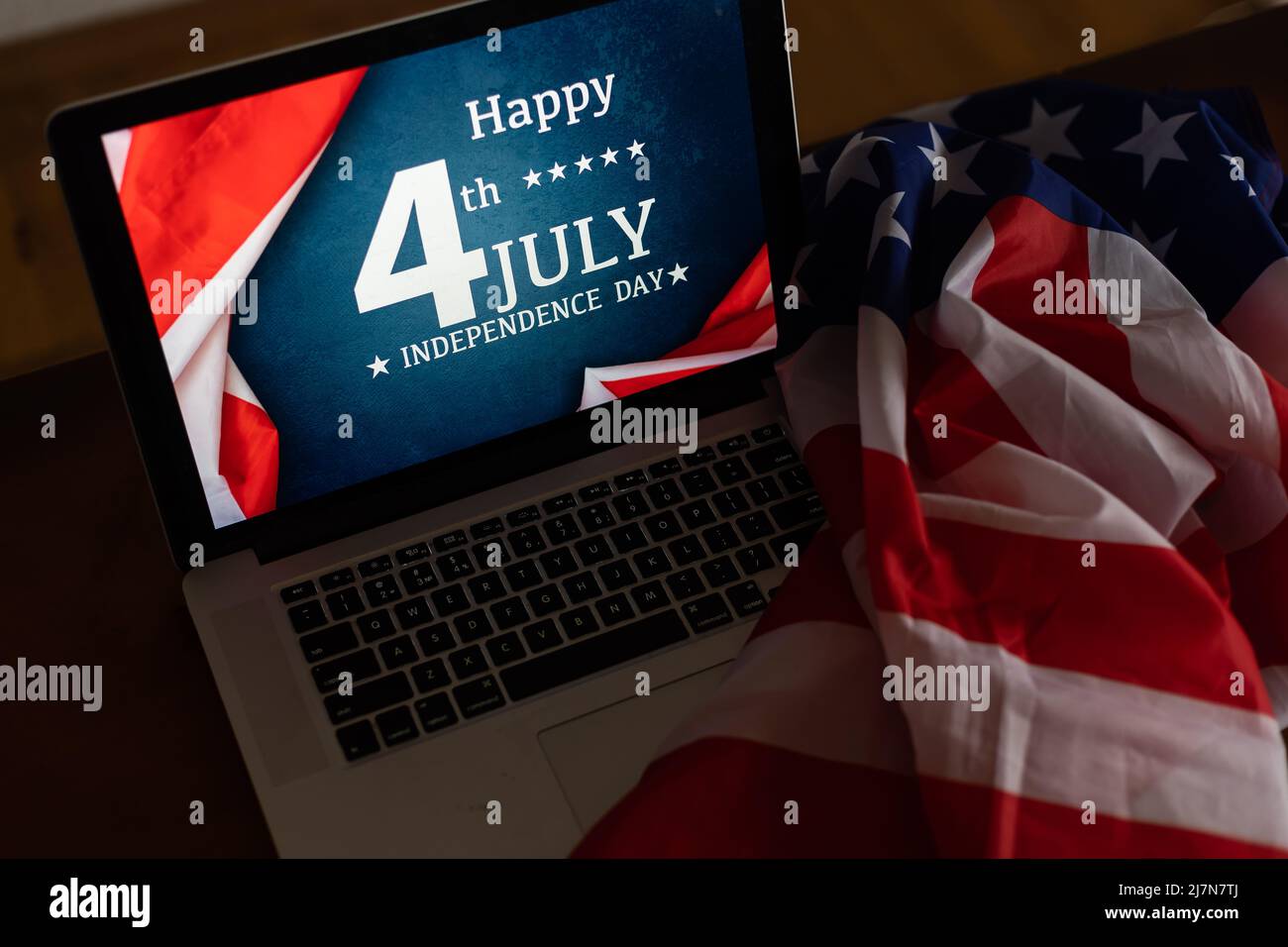 American flags with inscription Happy Independence Day on laptop Stock ...