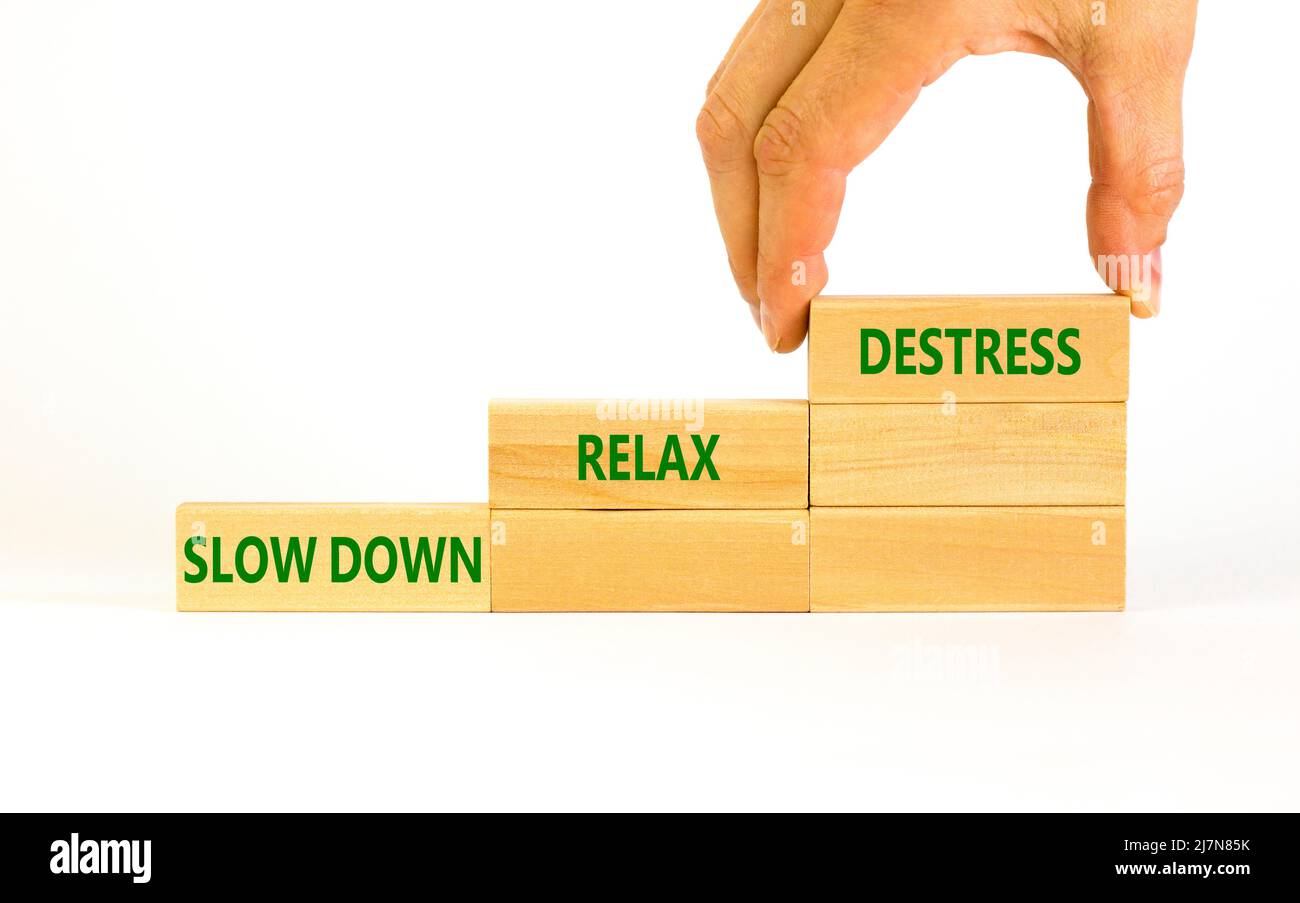 Destress symbol. Concept words Slow down Relax Destress on wooden ...