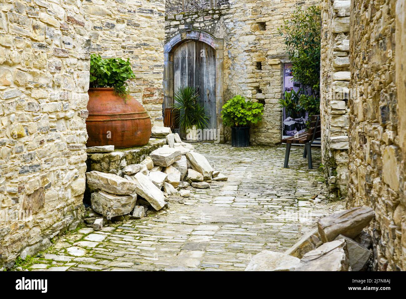 traditional idyllic yard in a mountain village in Cyprus with large old ...
