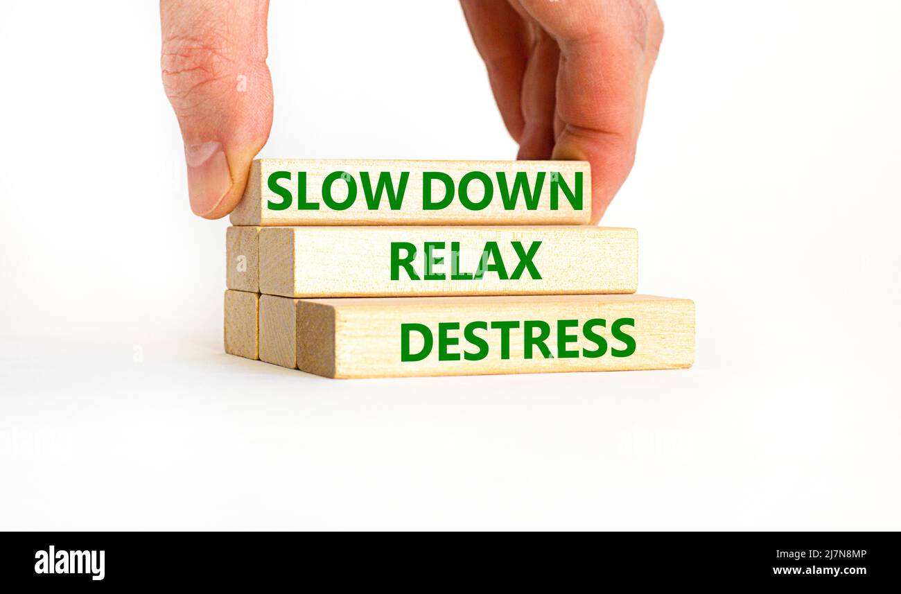 Destress symbol. Concept words Slow down Relax Destress on wooden ...