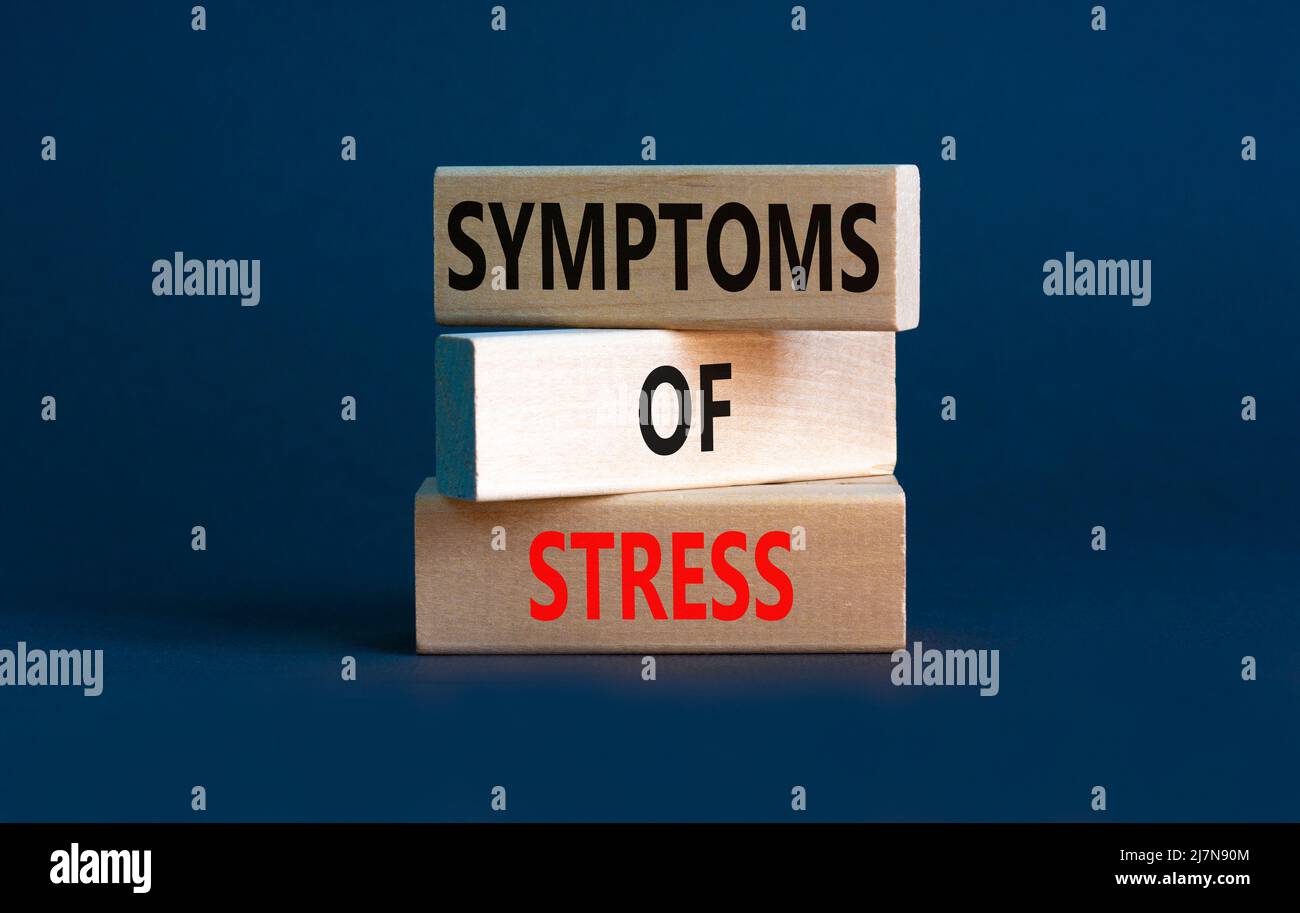 Symptoms of stress symbol. Concept words Symptoms of stress on wooden ...