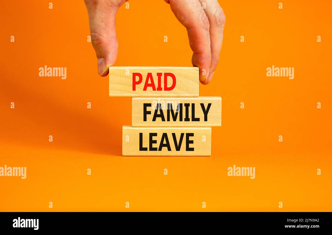 Paid family leave symbol. Concept words Paid family leave on wooden ...