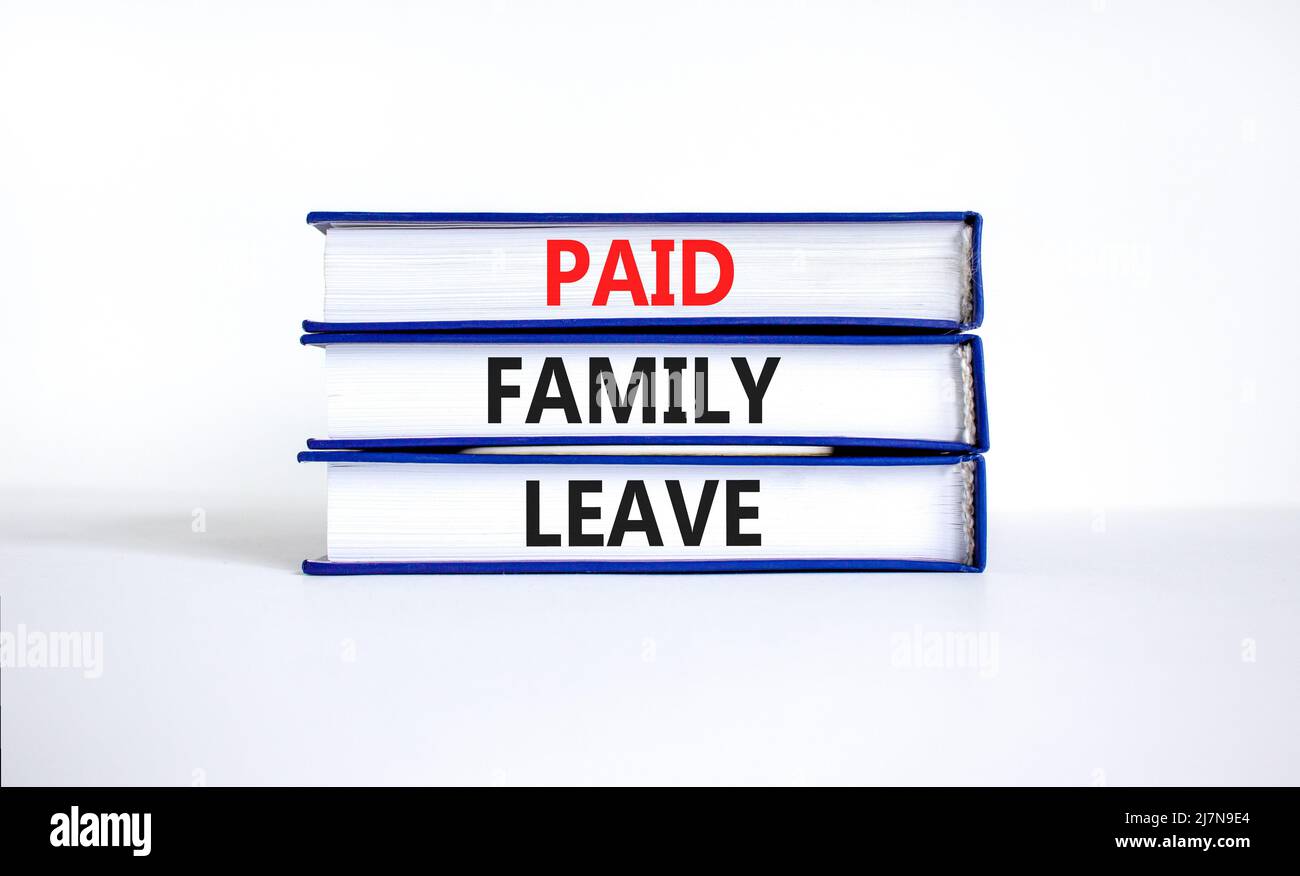 Paid family leave symbol. Concept words Paid family leave on books ...
