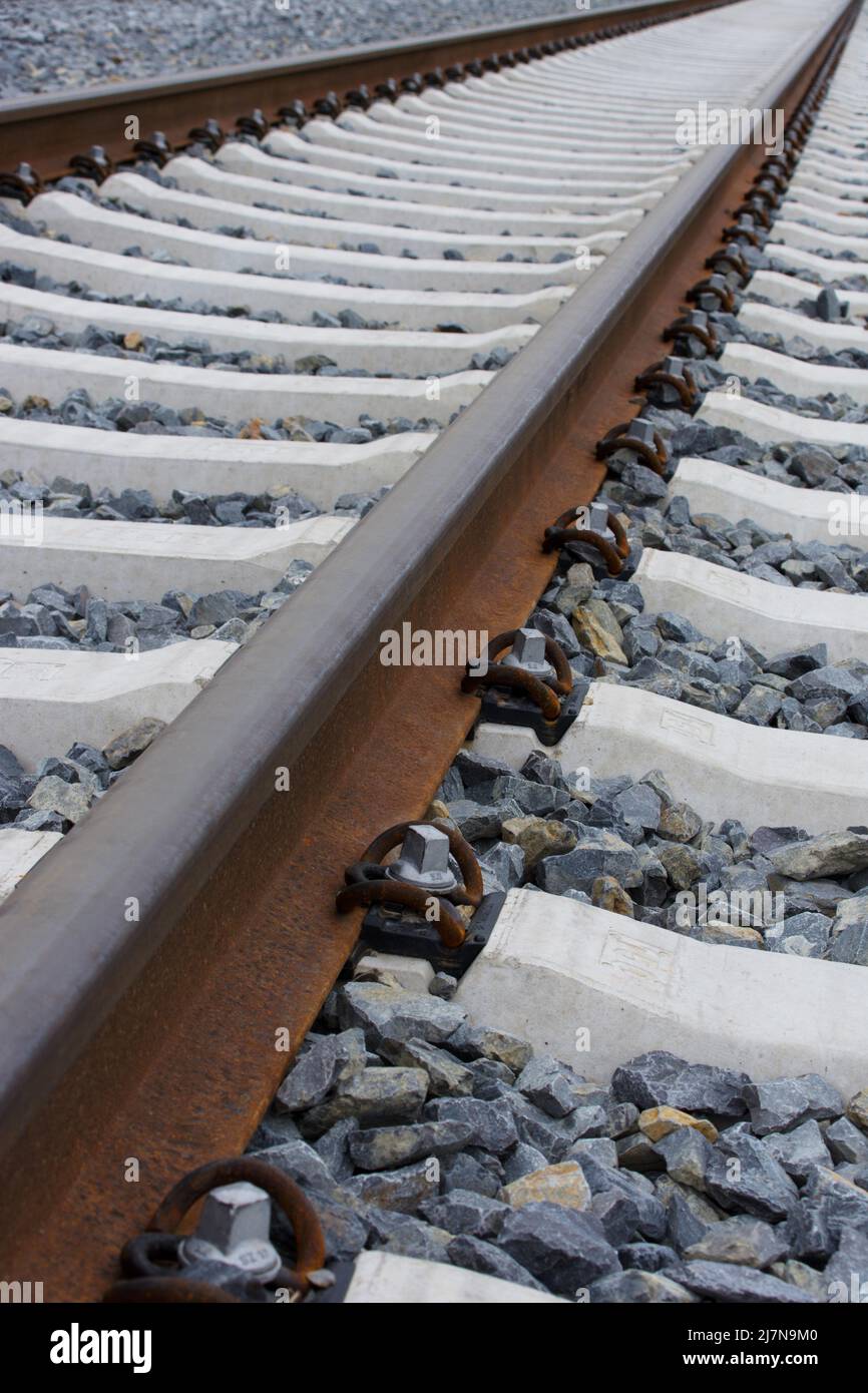 Newly constructed train tracks in portrait format Stock Photo - Alamy