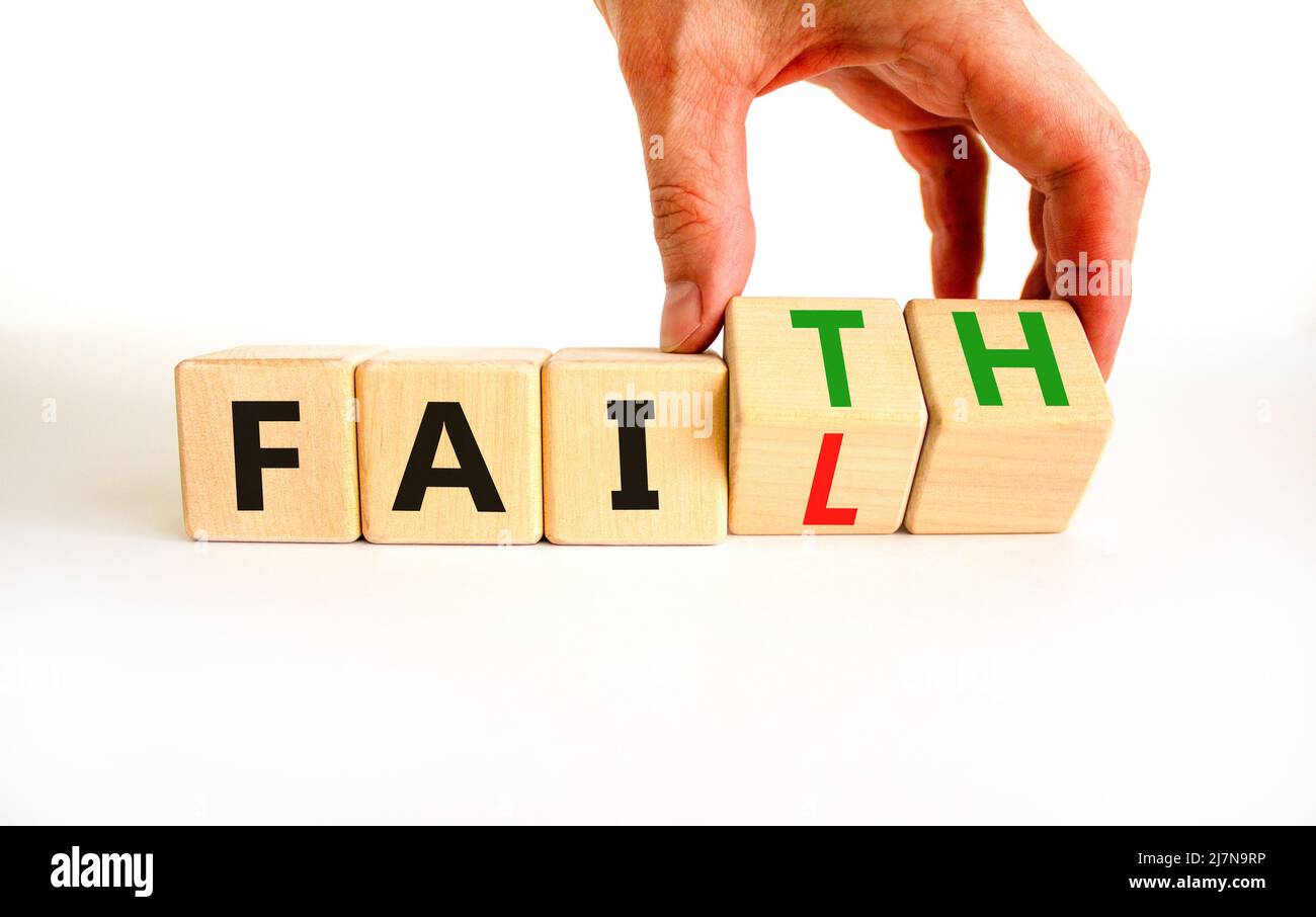 Faith instead fail symbol. Businessman turns wooden cubes and changes ...