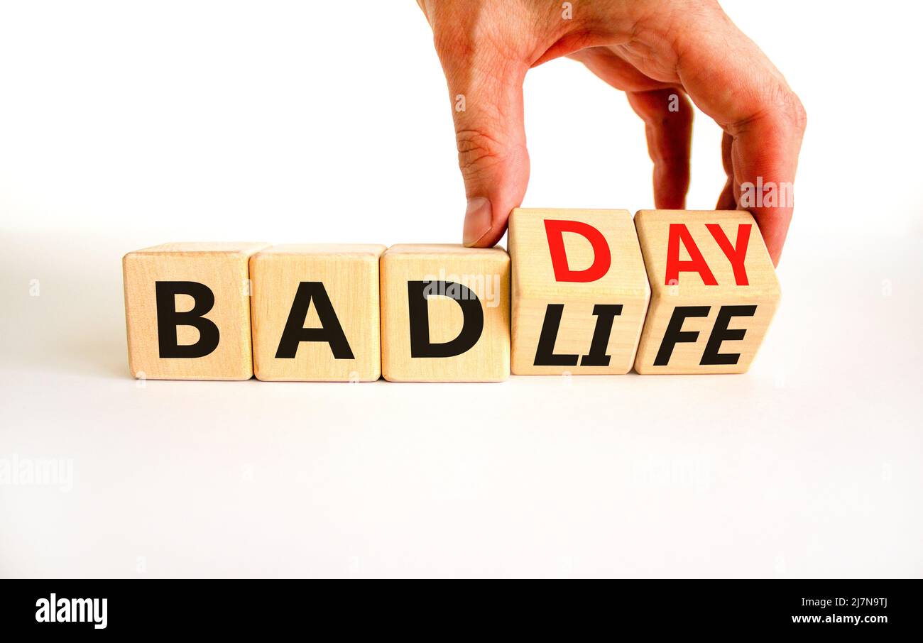 Bad day or life symbol. Businessman turns wooden cubes and changes ...