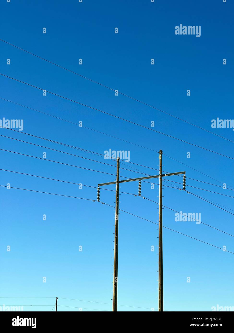 Hydroelectric power lines in the country, against a blue sky Stock ...