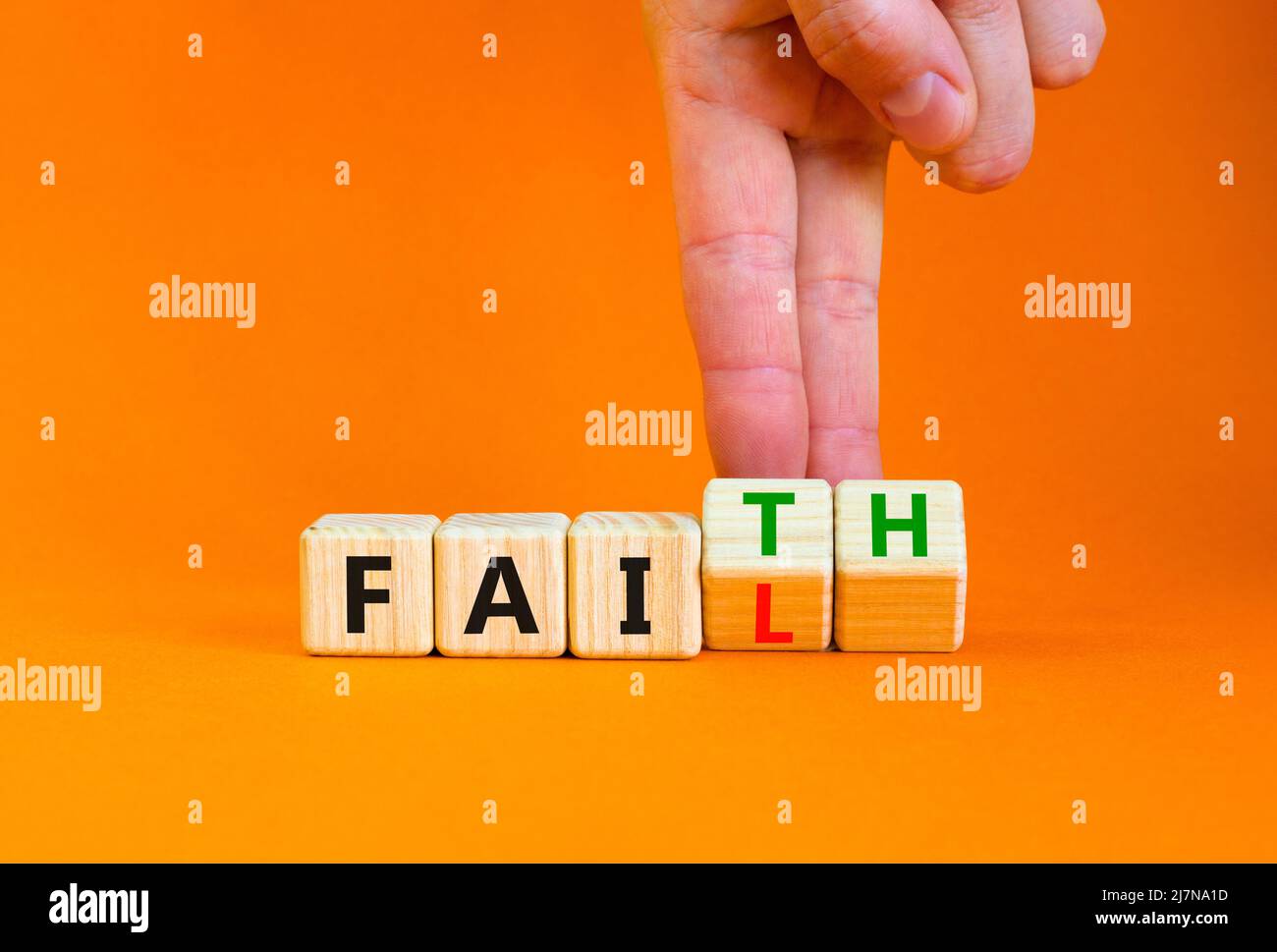 Faith instead fail symbol. Businessman turns wooden cubes and changes ...