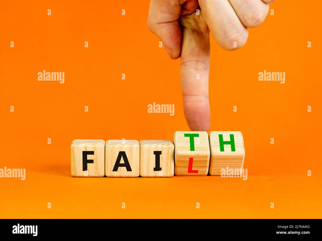Faith instead fail symbol. Businessman turns wooden cubes and changes ...