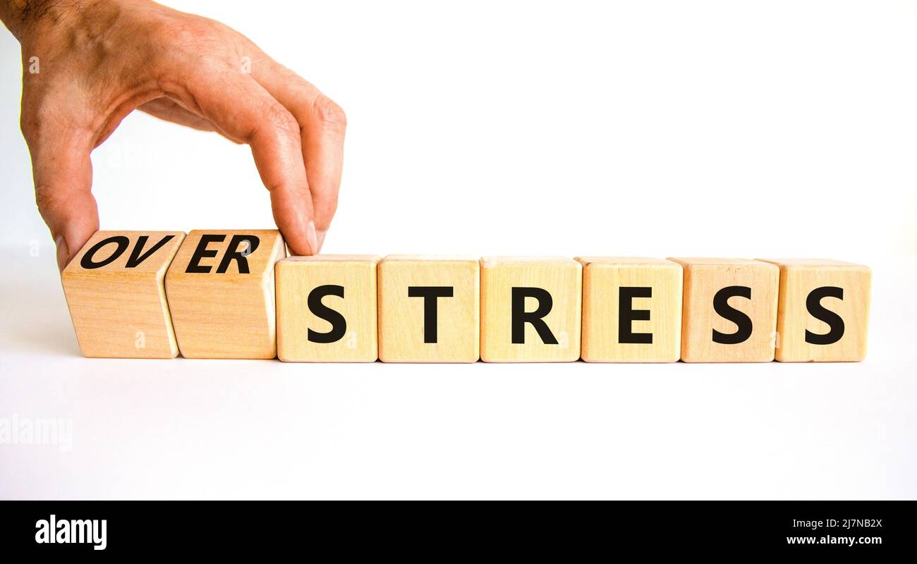 Over stress symbol. Psychologist turns wooden cubes and changes the ...