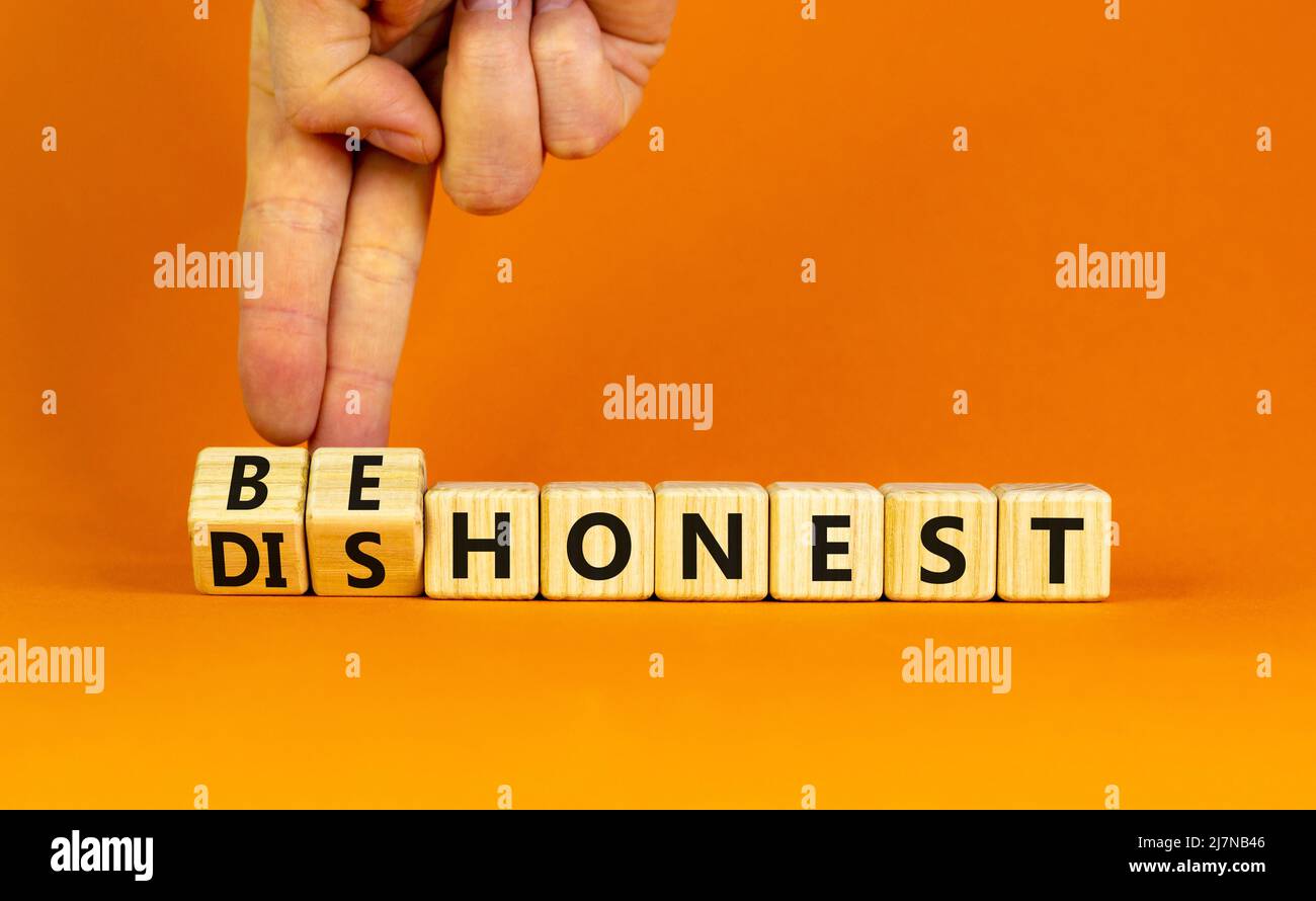 Be honest or dishonest symbol. Businessman turns cubes and changes ...