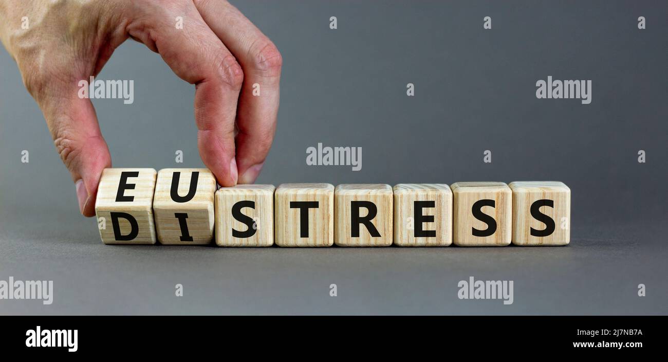 Eustress or distress symbol. Psychologist turns cubes and changes the ...