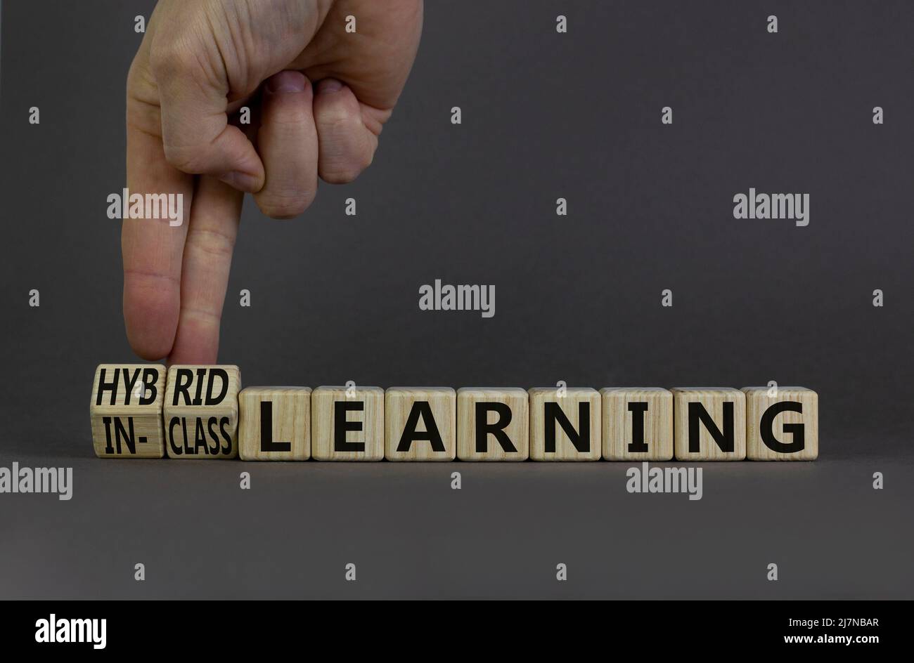 Hybrid or in-class learning symbol. Businessman turns cubes, changes ...