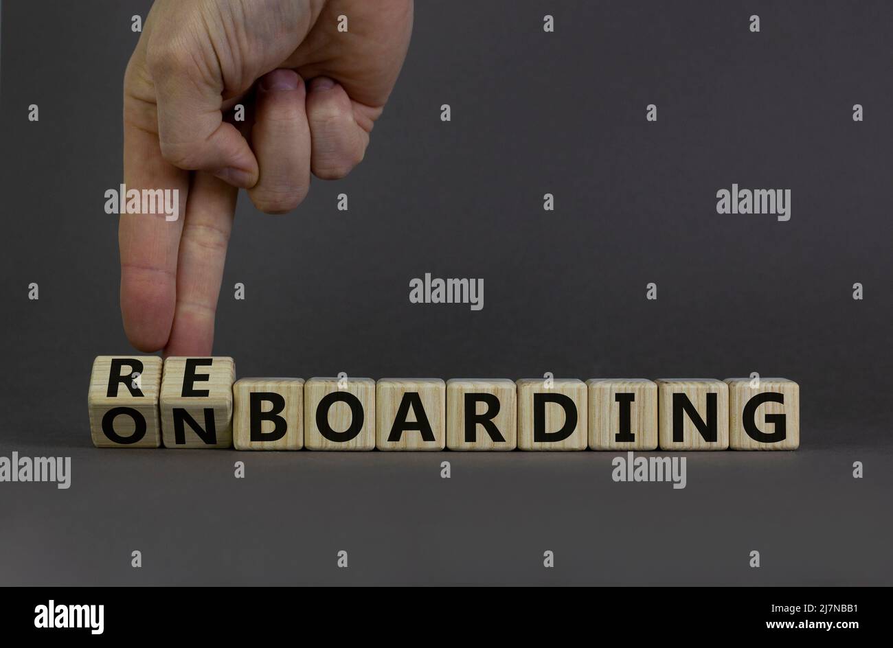 Onboarding or reboarding symbol. Businessman turns wooden cubes and ...
