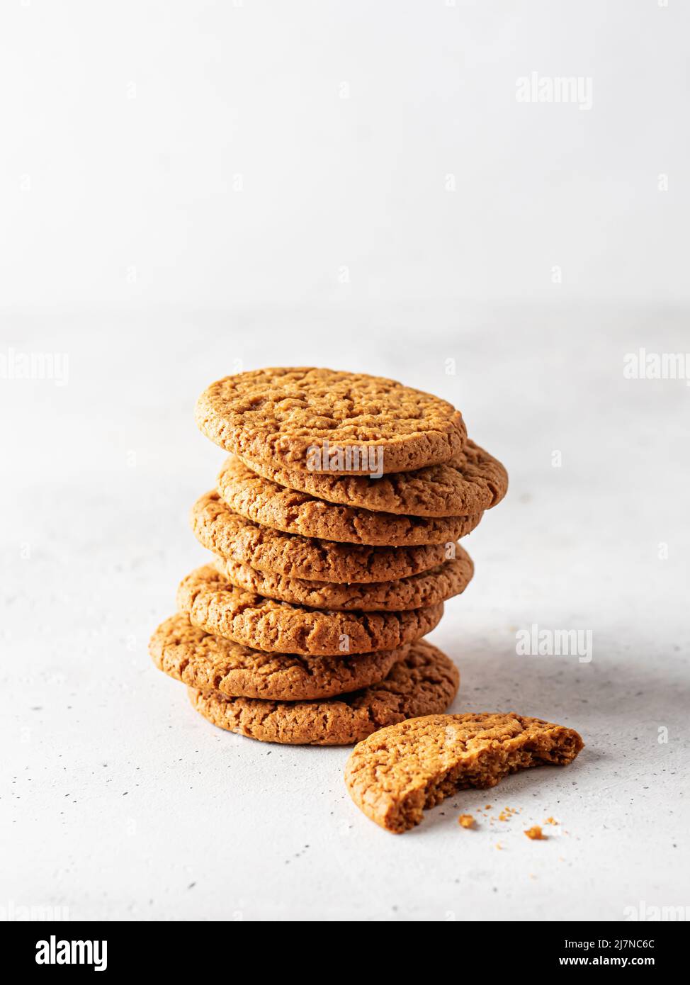 Stack of oatmeal cookies on white background. Vertical orientation ...