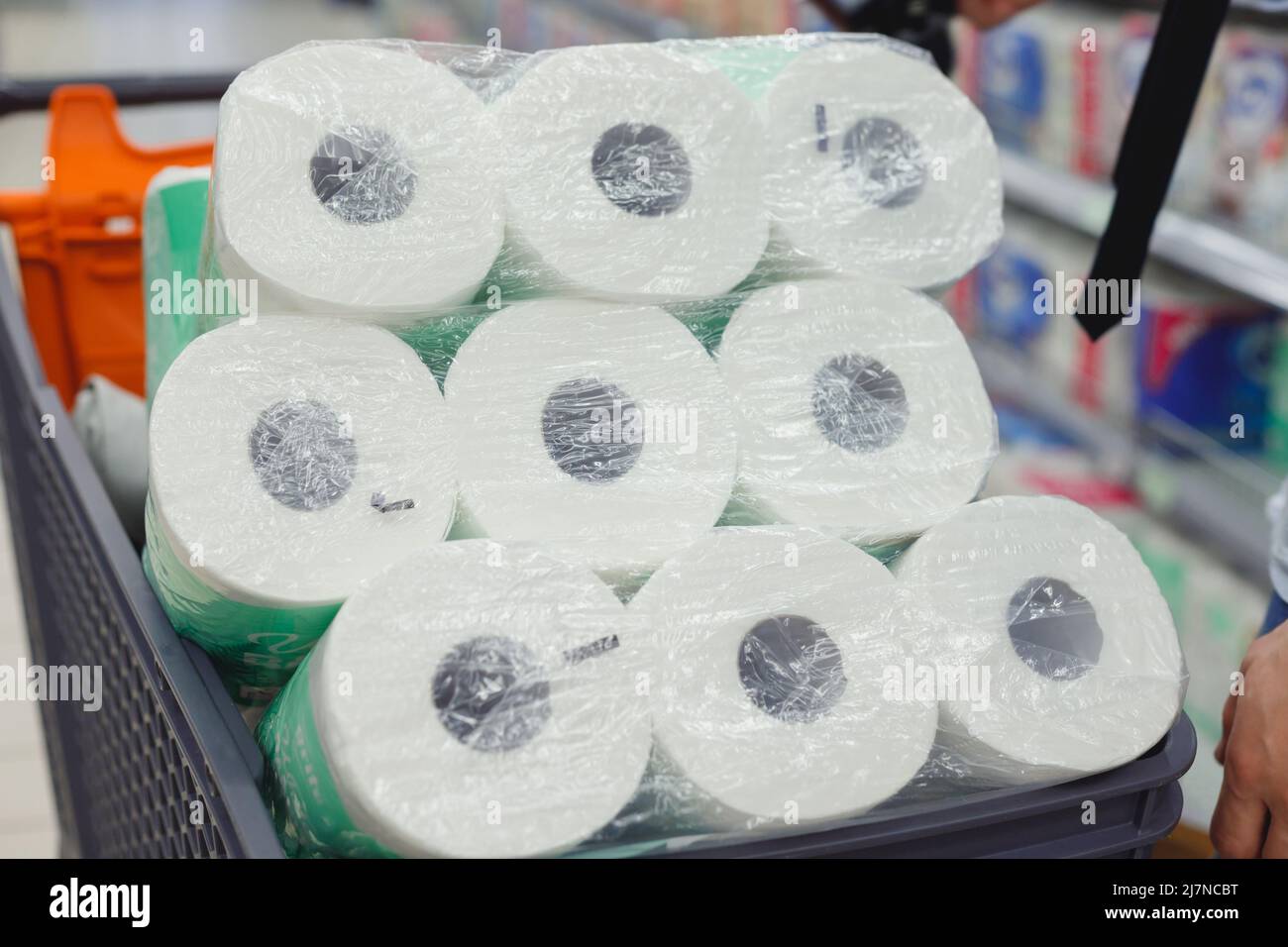 Shopping trolley full of toilet paper packs in supermarket Stock Photo ...