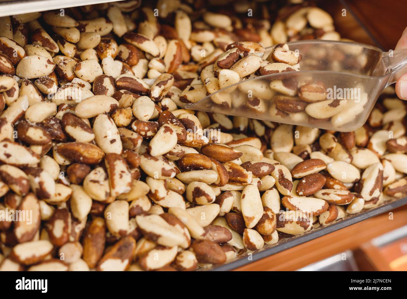 Brazilian nuts in with shovel on counter in organic super market Stock ...