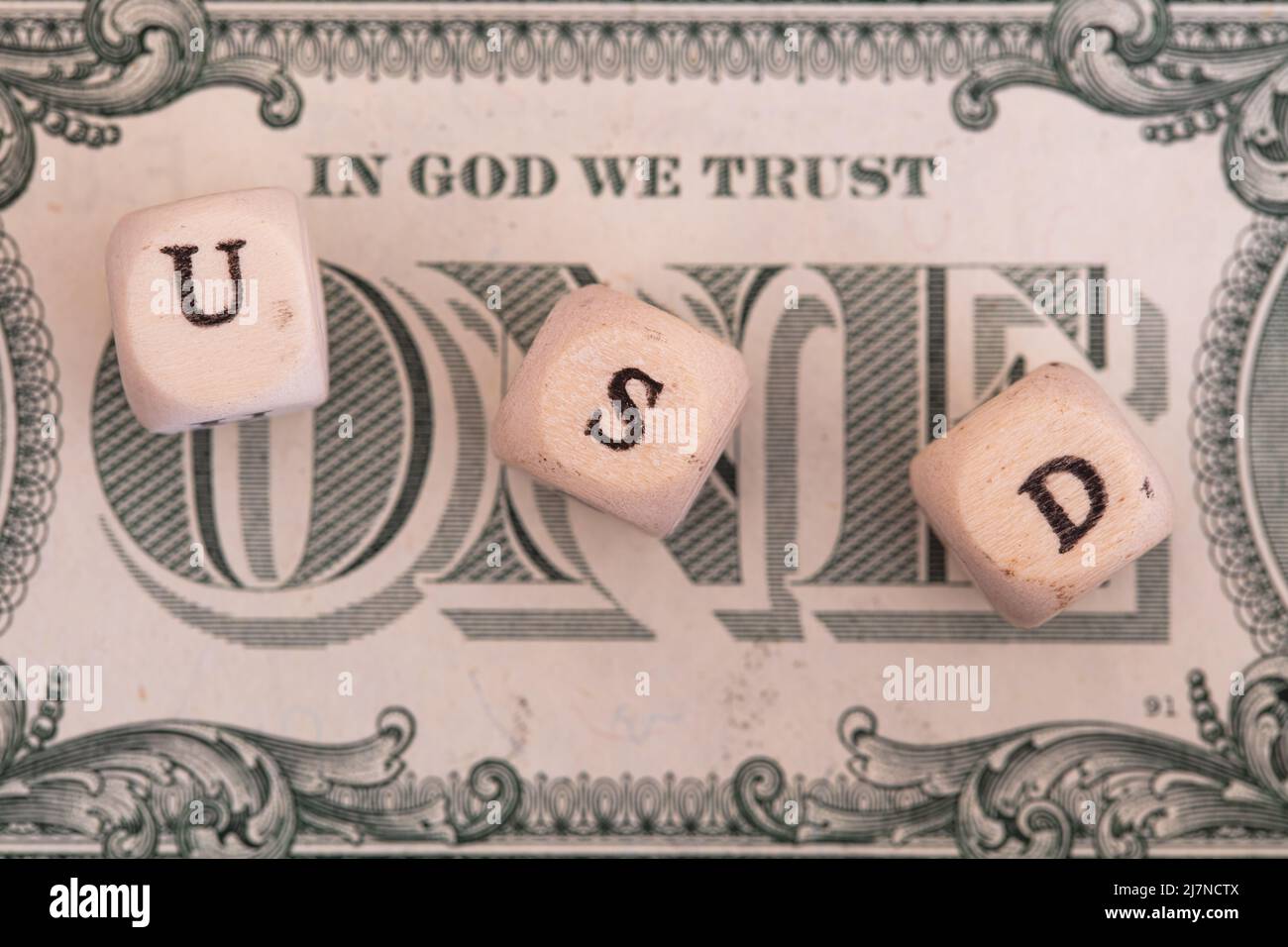 USD word written on wooden blocks on 1 dollar banknote background for ...