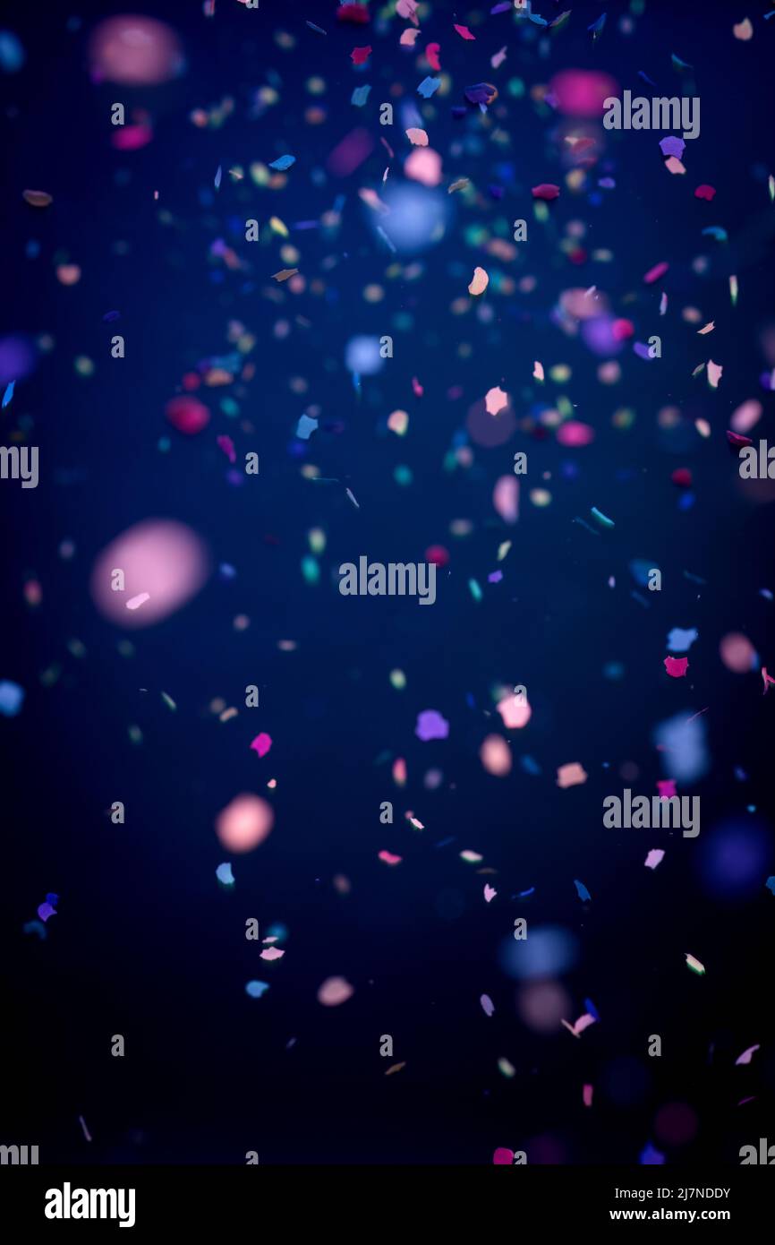 Dark blue background with confetti vertical Stock Photo - Alamy