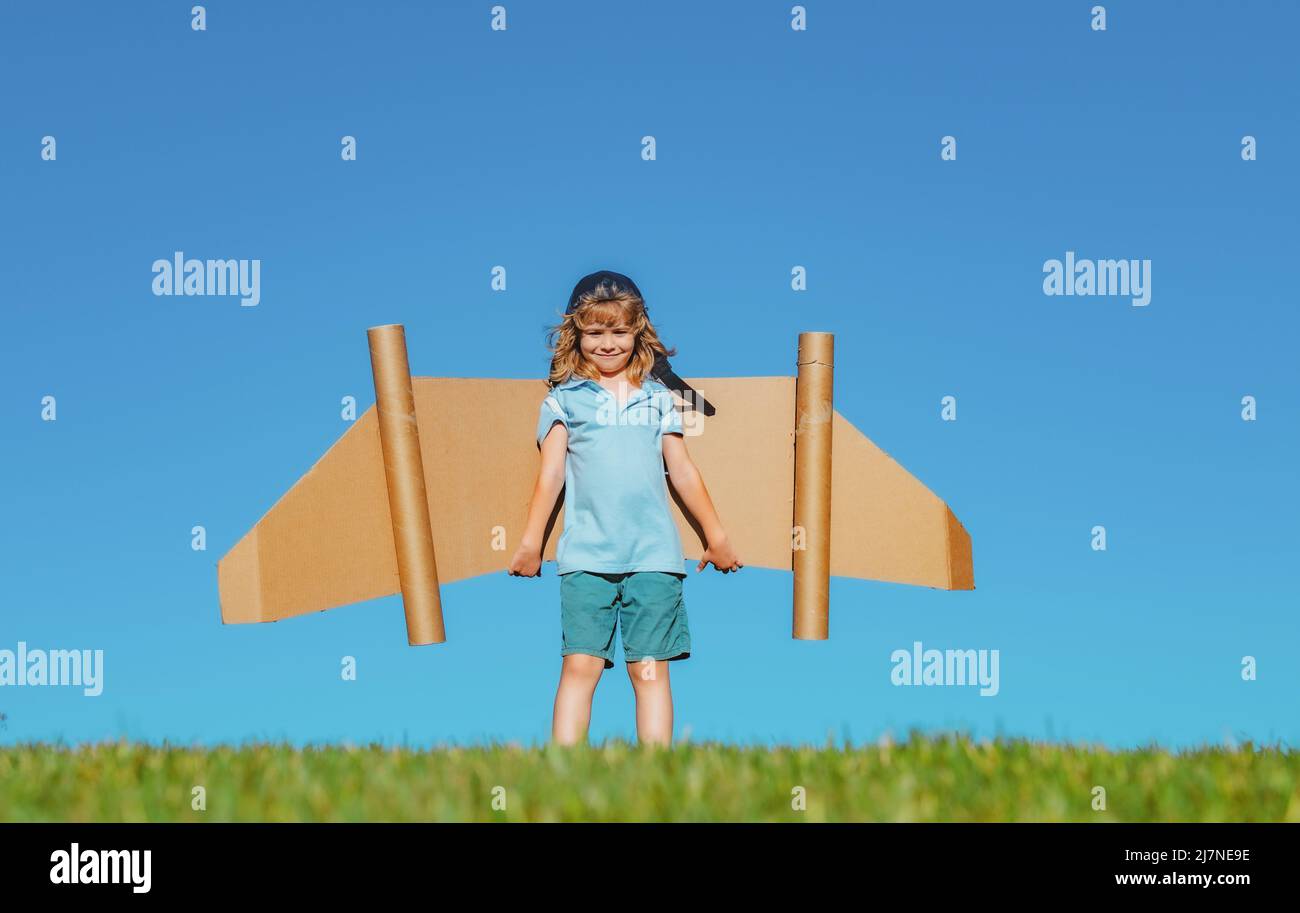 Kid with jet pack superhero. Child pilot against summer sky background ...